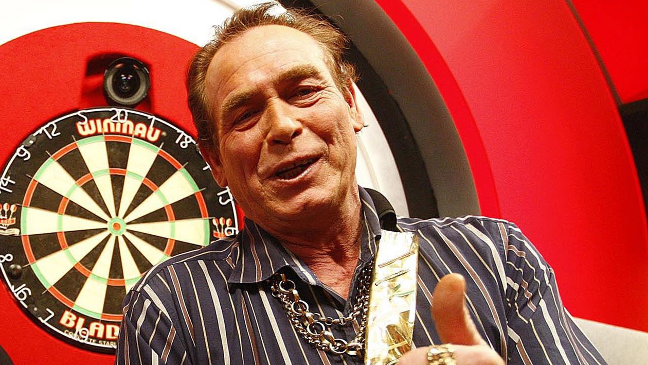 Darts legends Bobby George and Peter Manley in action at Market Rasen